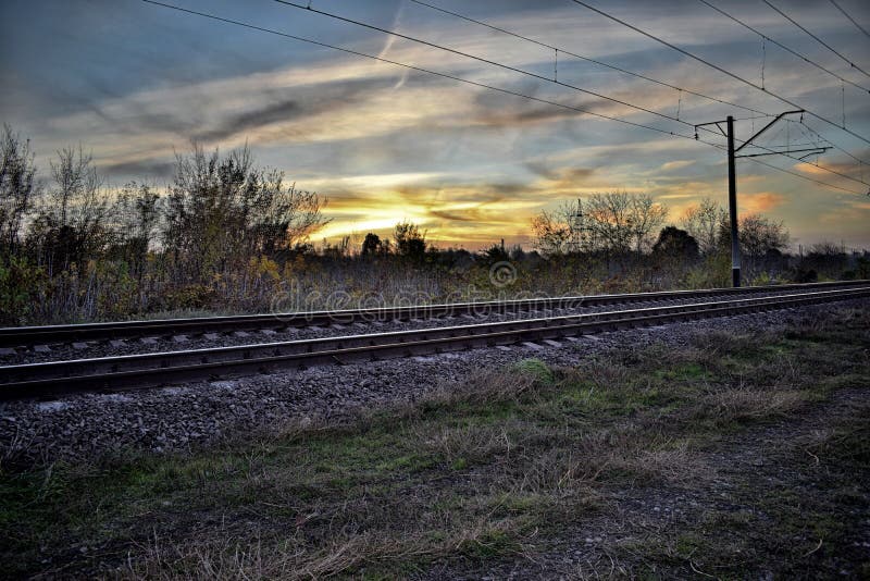 Sunset over the rails stock image. Image of nature, landscape - 131864549