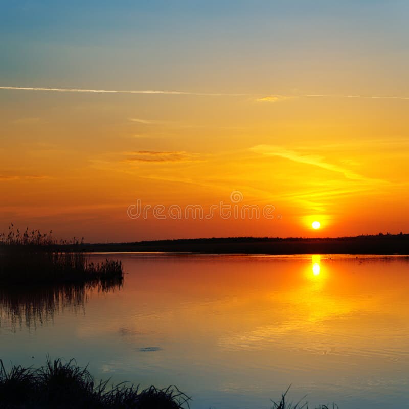 Sunset over river stock photo. Image of dark, hill, golden - 24626654