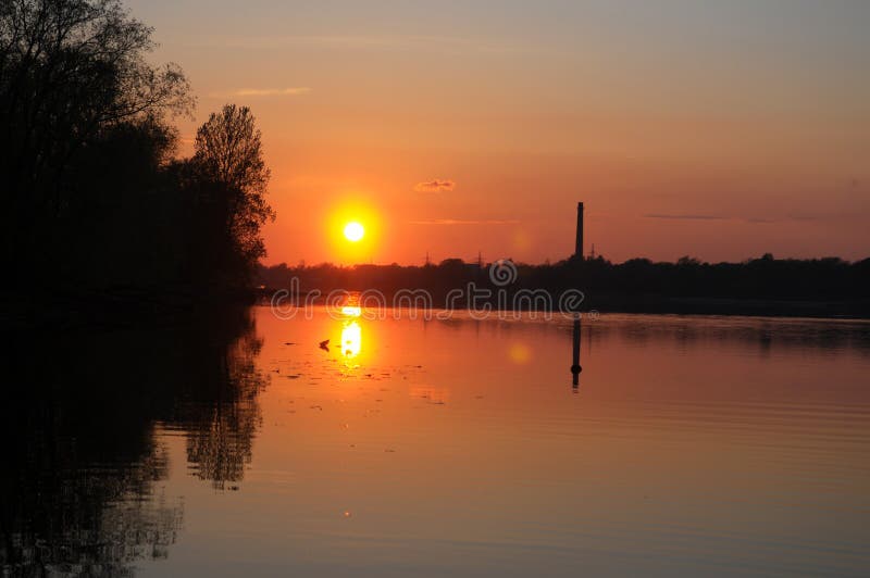 Sunset over river stock photo. Image of main, mirror, surface - 9973966