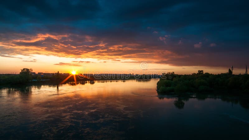 Sunset Over the River in Dark Orange-blue Tones. Stock Image - Image of ...