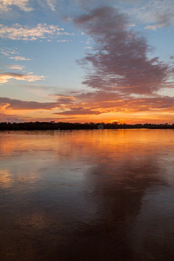 Sunset over river Napo stock photo. Image of dusk, lake - 131783808
