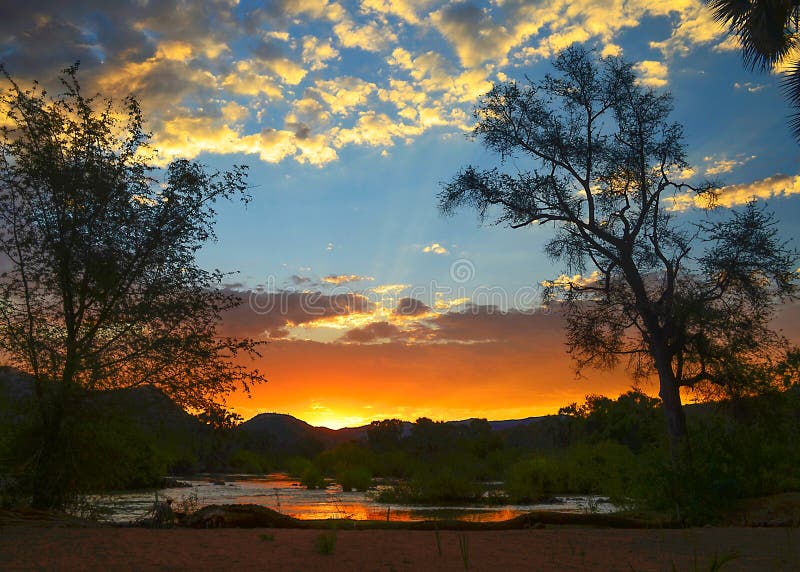 Sunset Over a River with Trees Stock Image - Image of river, epupa ...