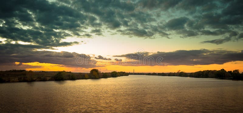 Sunset over riverside stock photo. Image of beautiful - 61897518
