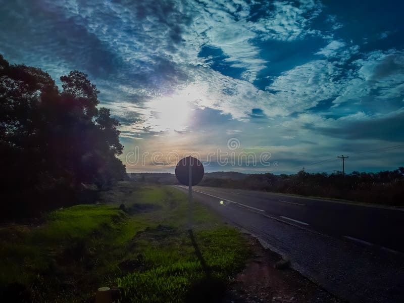 Sunset over the road. stock image. Image of beauty, nature - 258574013