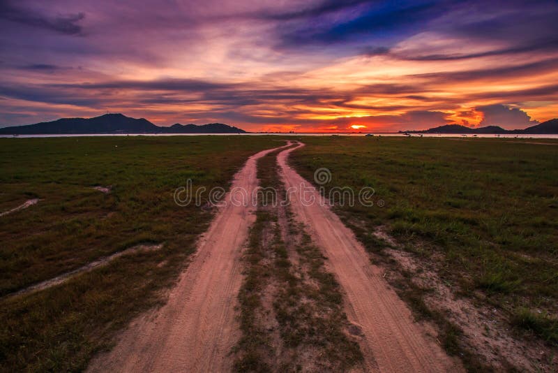 Sunset over road stock photo. Image of landscape, beam - 57973646