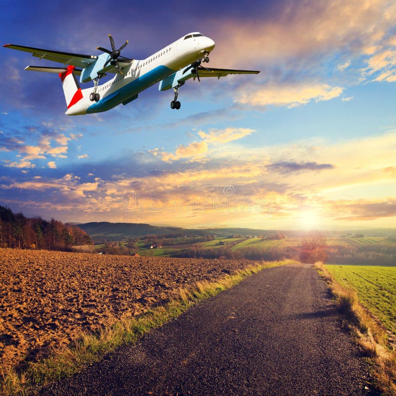 Sunset Over Road with Plane Stock Photo - Image of idyllic, mountain ...