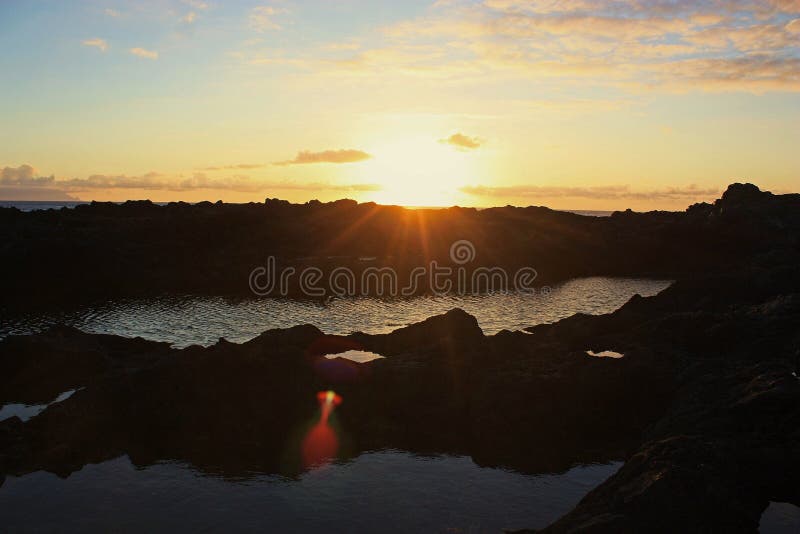 Sunset Over Rocks and the Sea Stock Image - Image of tropical, calm ...