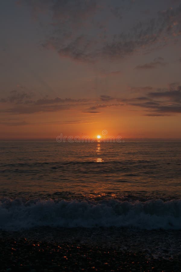 Beautiful Sunset Over the Sea. the Sun Sets Over the Sea Horizon Stock ...