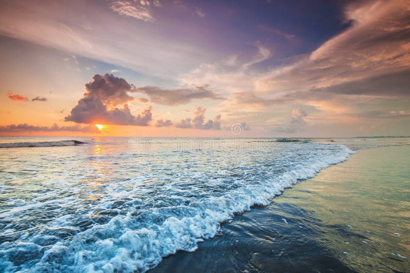 Sunset over sea on Bali stock image. Image of nature - 80537317