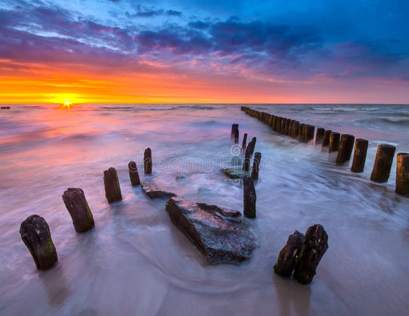 Sunset over the sea beach stock image. Image of landmark - 64400959