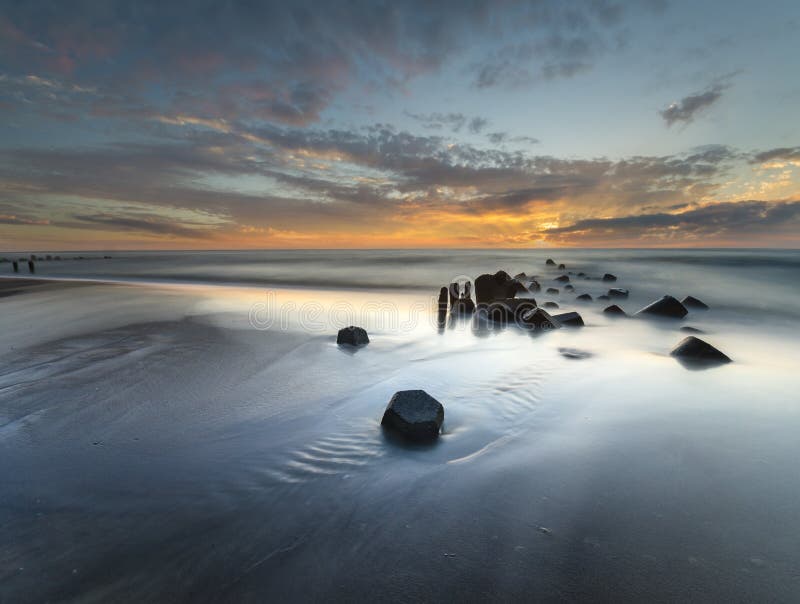 Sunset over the sea beach stock image. Image of lake - 49660149