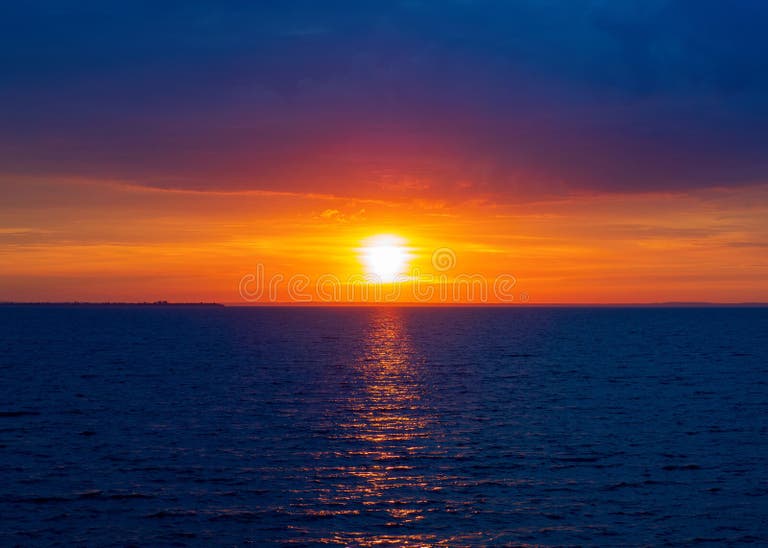 Sunset Over the Sea. Dramatic Cloudscape in Bright Colors. Sun ...