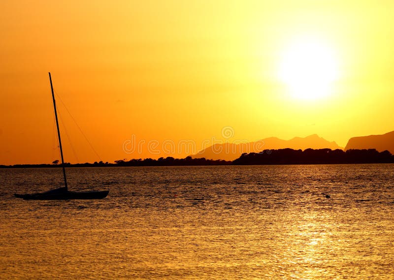 Sunset Over the Sea with Promontory in the Background Stock Image ...