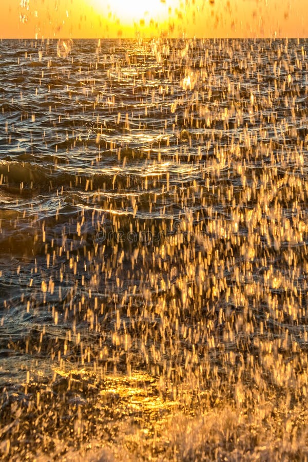 Setting Sun through a Spray in the Backlight Stock Image - Image of ...