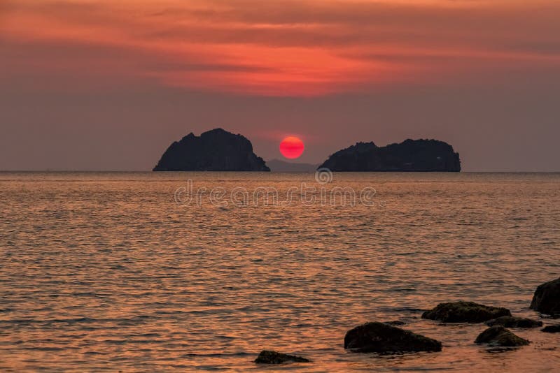 Sunset Over the Sea and the Sun Setting into the Water between the ...