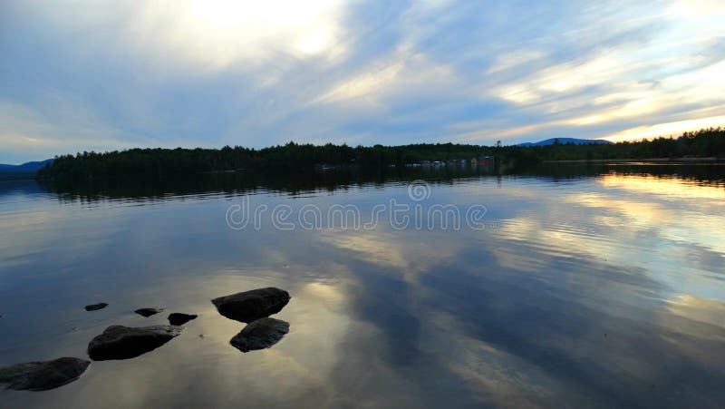 Sunset over smooth lake stock photo. Image of peaceful - 88669084