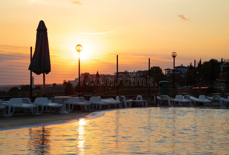 Sunset Over a Swiming Pool at the Seaside. Stock Photo - Image of ...