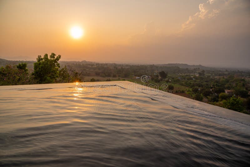 Sunset Over the Swimming Pool with Mountain View Stock Photo - Image of ...