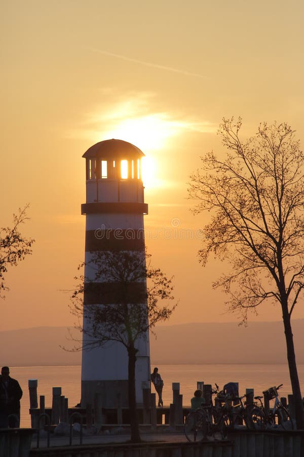 Tall Red Lighthouse in Florida with Trees and Holiday Decorations Stock ...