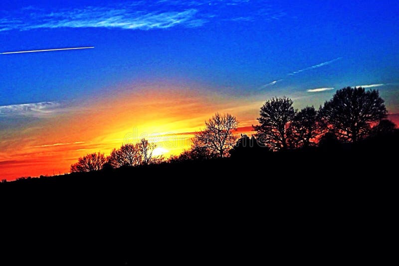 Sunset over trees stock photo. Image of trees, shadows - 48519276