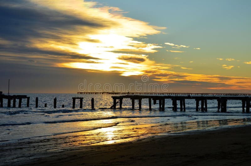 Sunset Over Two Old Jetties Stock Image - Image of sunset, area: 219654079