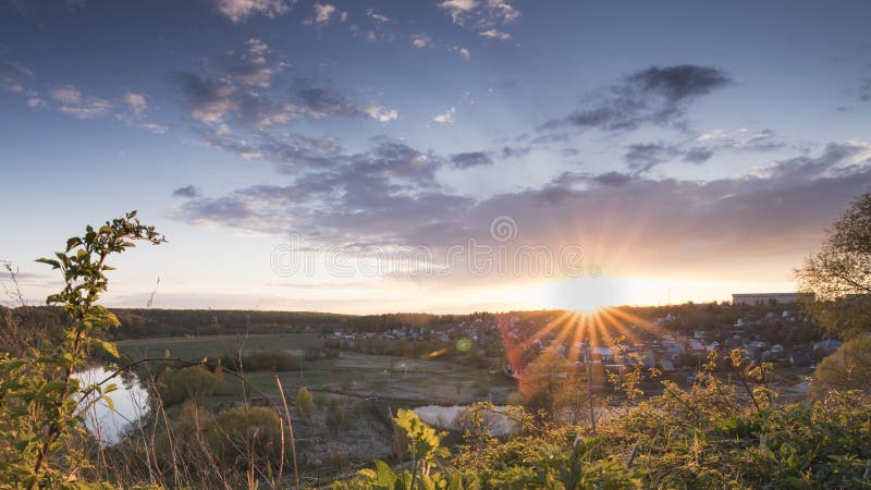 Sunset over the village. stock image. Image of light - 93725265
