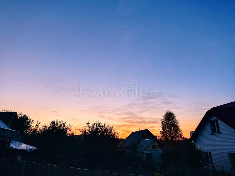 Sunset over the village stock photo. Image of horizon - 255506934