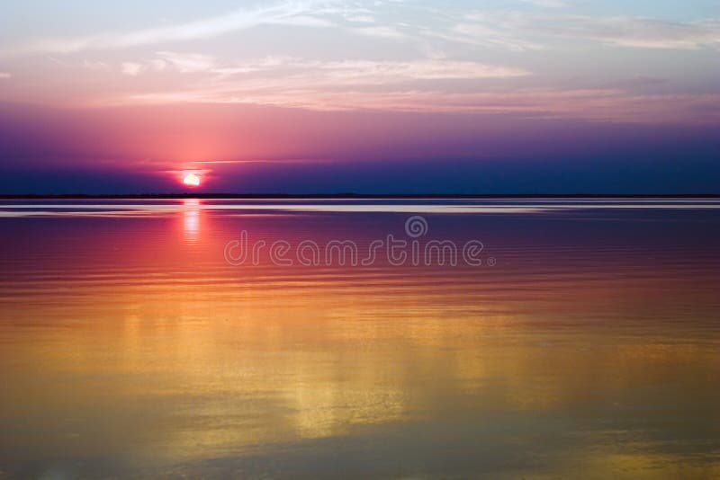 Vibrant sunset over water stock image. Image of colourful - 31658537