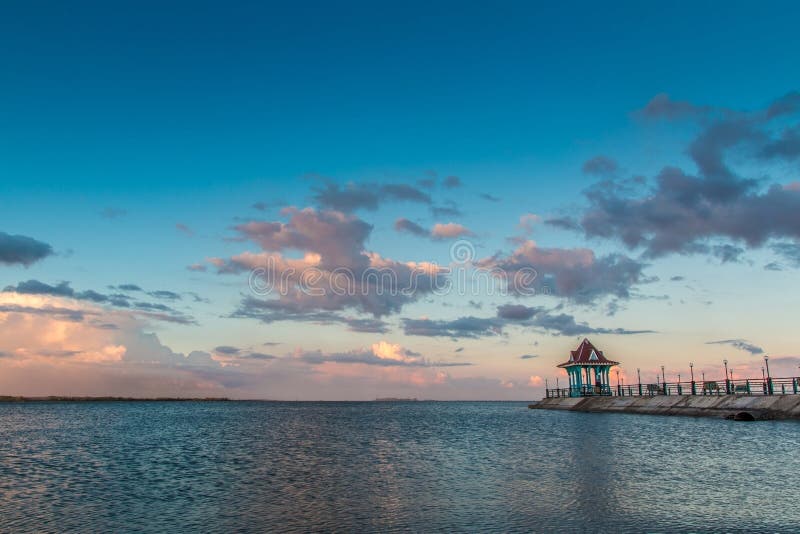 Sunset over the water stock photo. Image of pink, large - 64128134