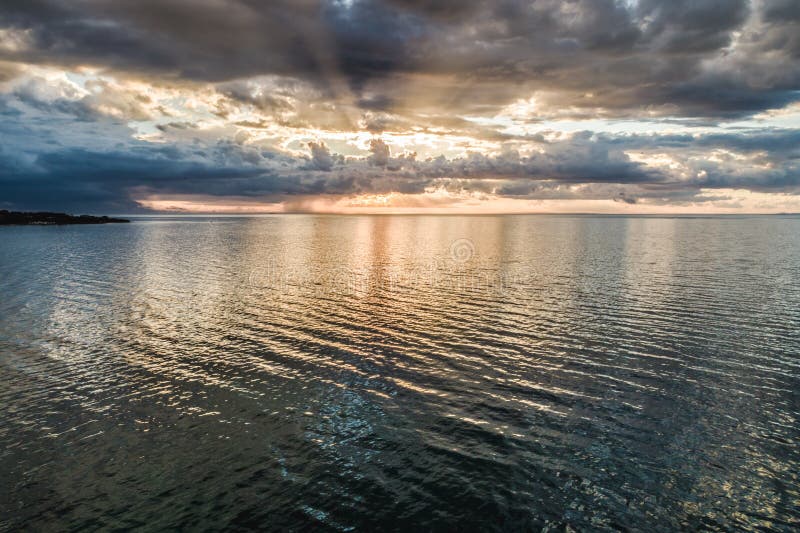 Sunset Over Water with Sun Rays. Stock Image - Image of drone ...
