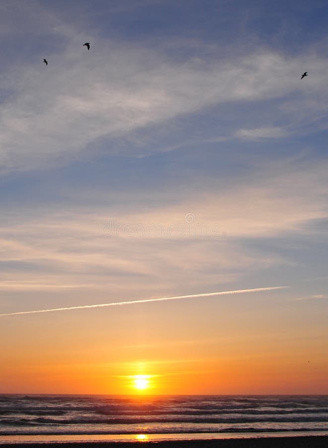 Sunset over waves on beach stock photo. Image of blue - 25129344