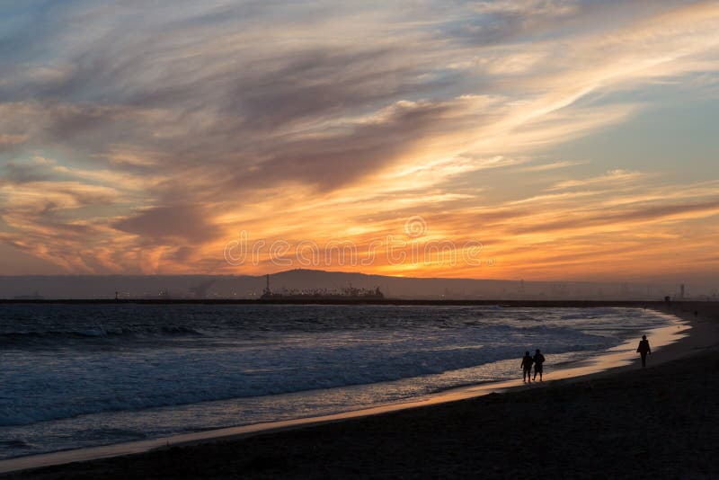 Sunset Over Waves Hitting the Beach on the West Coast Stock Photo ...