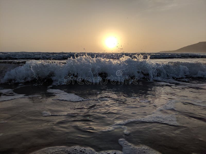 Sunset over the waves stock image. Image of sunsetandwaves - 149810197