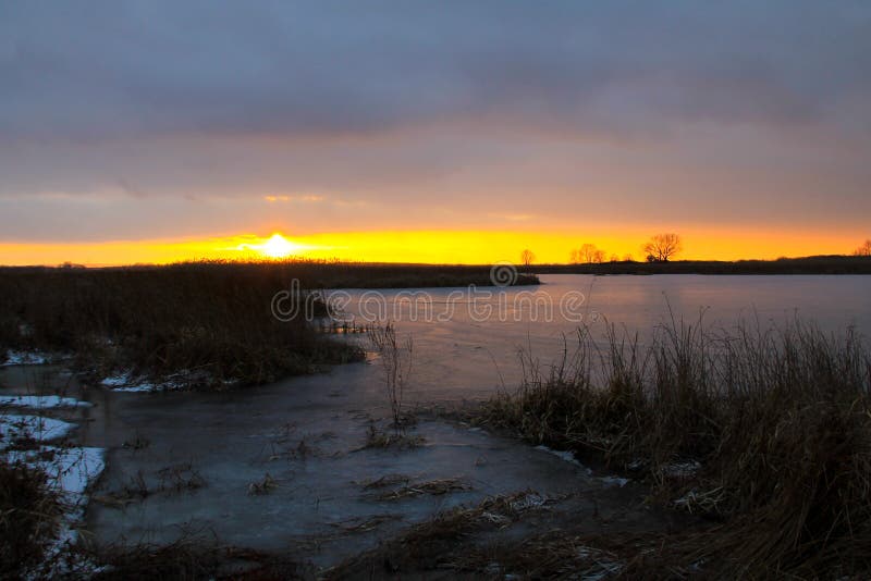 Sunset over winter river stock image. Image of season - 165892405