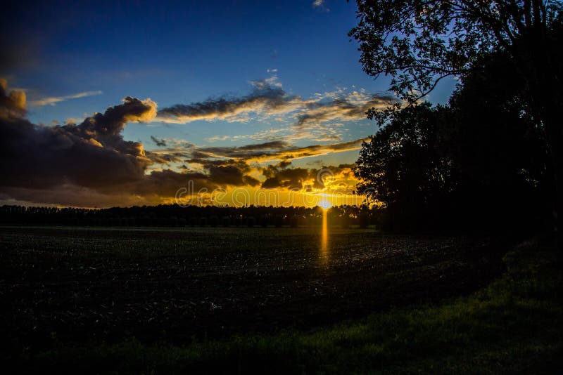 Sunset overcast day dutch stock photo. Image of sunset - 253899354