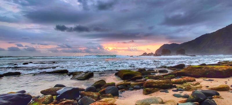 Sunset at Papuma Beach stock image. Image of shore, traveling - 241152731