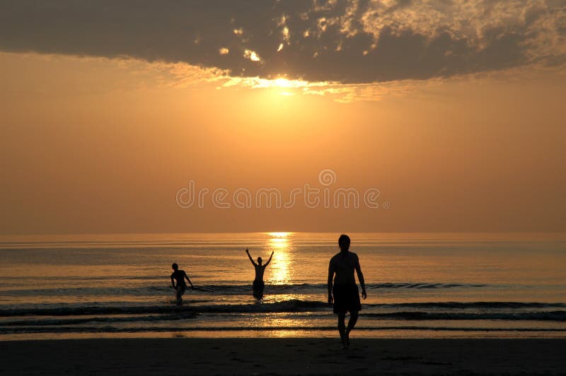 Sunset with people stock photo. Image of playing, beam - 1988598