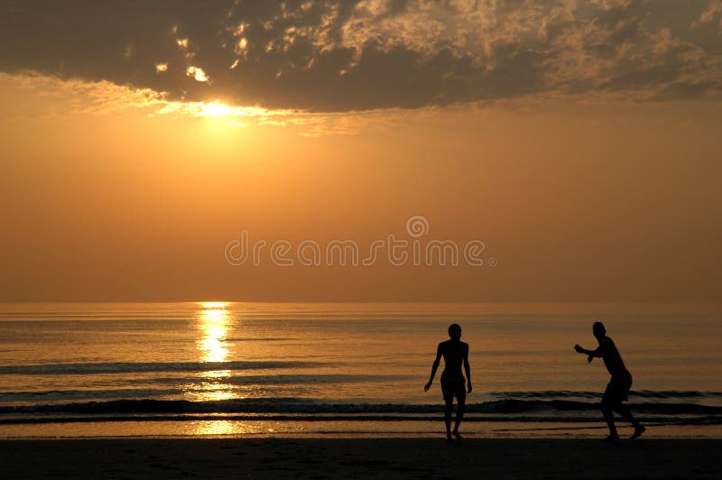 Sunset with people stock photo. Image of beach, water - 1988600