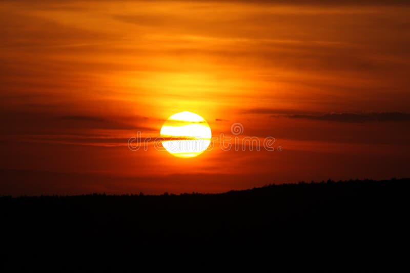 Sunset Photo of a Large Orange Sun Stock Photo - Image of scene, nature ...