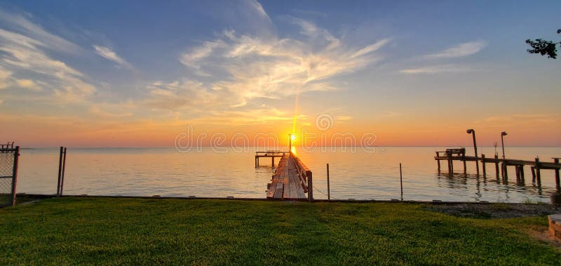 Sunset on pier stock photo. Image of tower, dusk, horizon - 236160888