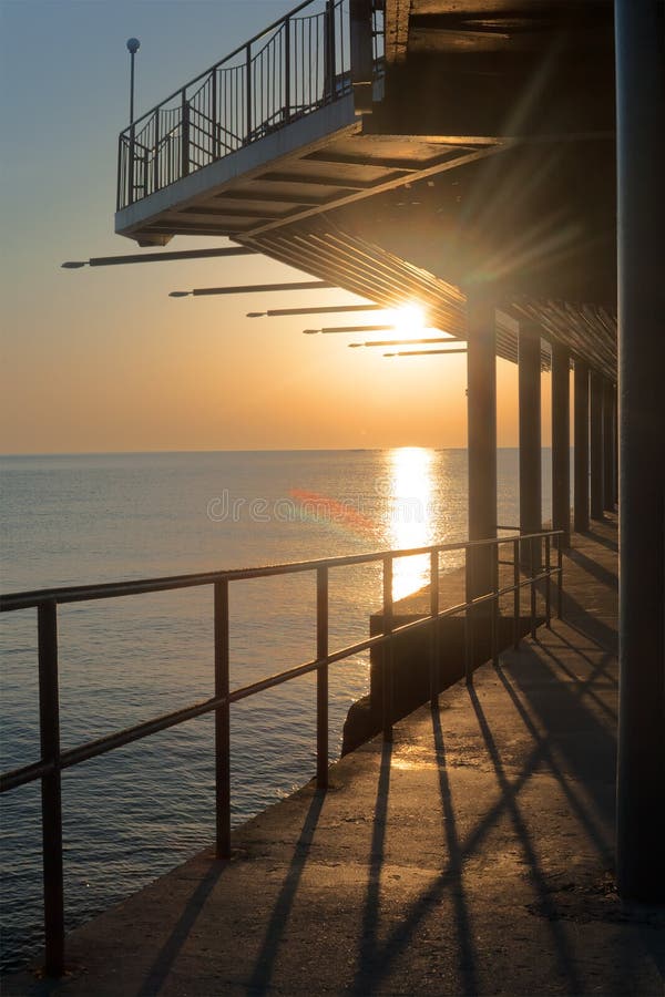 Sunset pier along coast stock image. Image of natural - 30720921