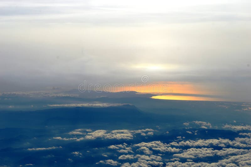 Sunset from the plane stock photo. Image of dusk, sunlight - 273464030