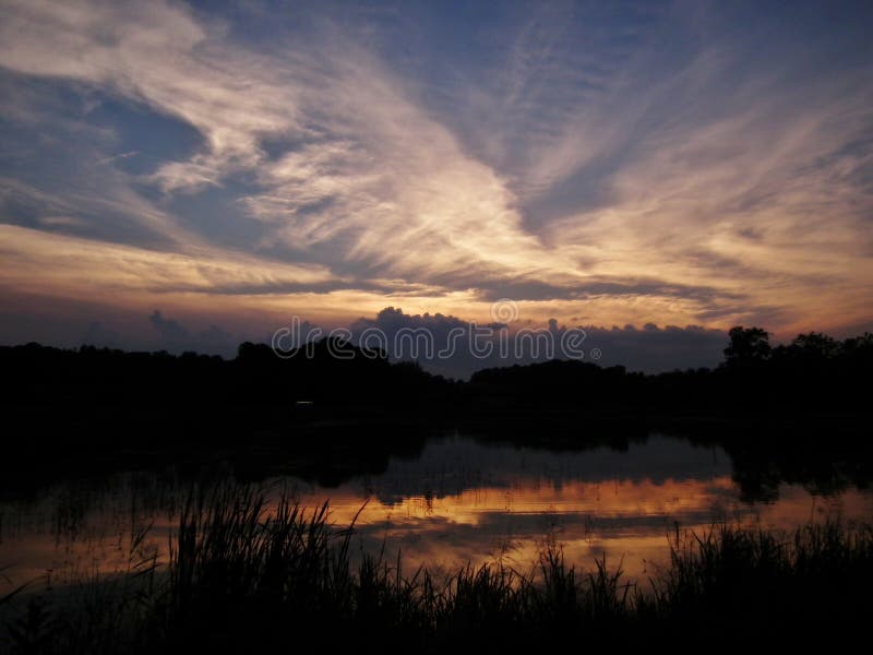 Sunset on the pond stock image. Image of evening, nature - 219473361
