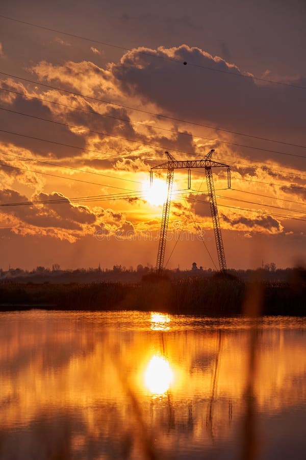Sunset with Power Lines and Lake Stock Image - Image of network, clouds ...