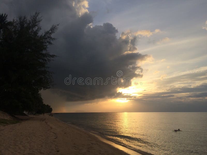 Rain and sun stock image. Image of sunset, beach, rain - 116602675
