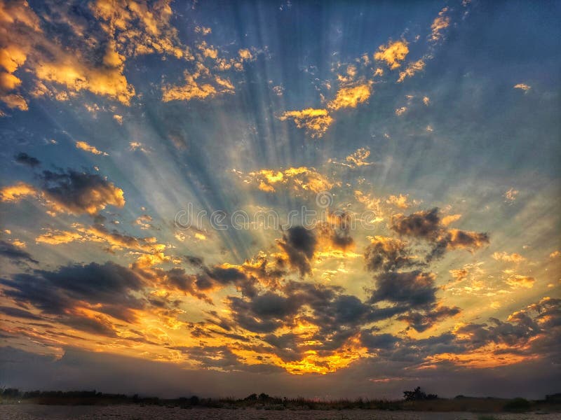Sunset stock image. Image of suns, rays, beautiful, pierce - 372306249