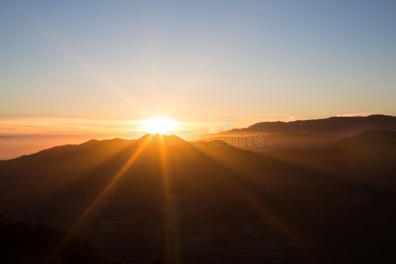 Sunset with Rays Behind Hill Stock Photo - Image of yellow, vista: 37249652