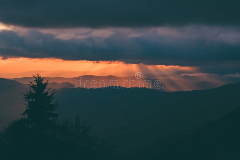 Stunning Alpine Landscape with Golden Skies and Dramatic Clouds Stock ...