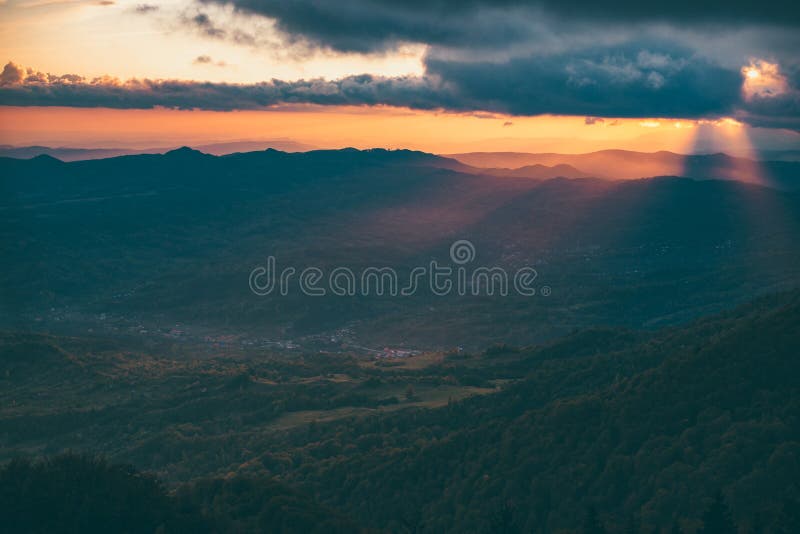 Stunning Alpine Landscape with Golden Skies and Dramatic Clouds Stock ...