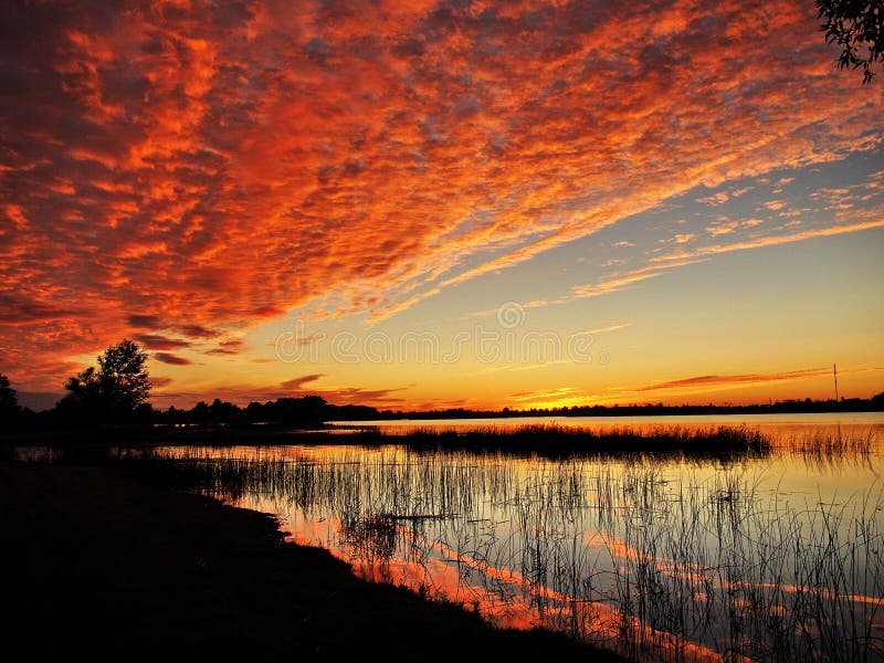 Landscape with Warm Sunset and Red Clouds Stock Photo - Image of wave ...